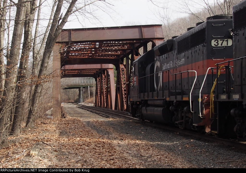 MEC 371 leads train symbol RJED across the Deerfield River a few miles below the Hoosac Tunnel ...